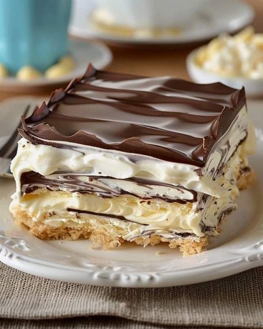 Decadent Chocolate Eclair Layer Cake" - CYSSERO