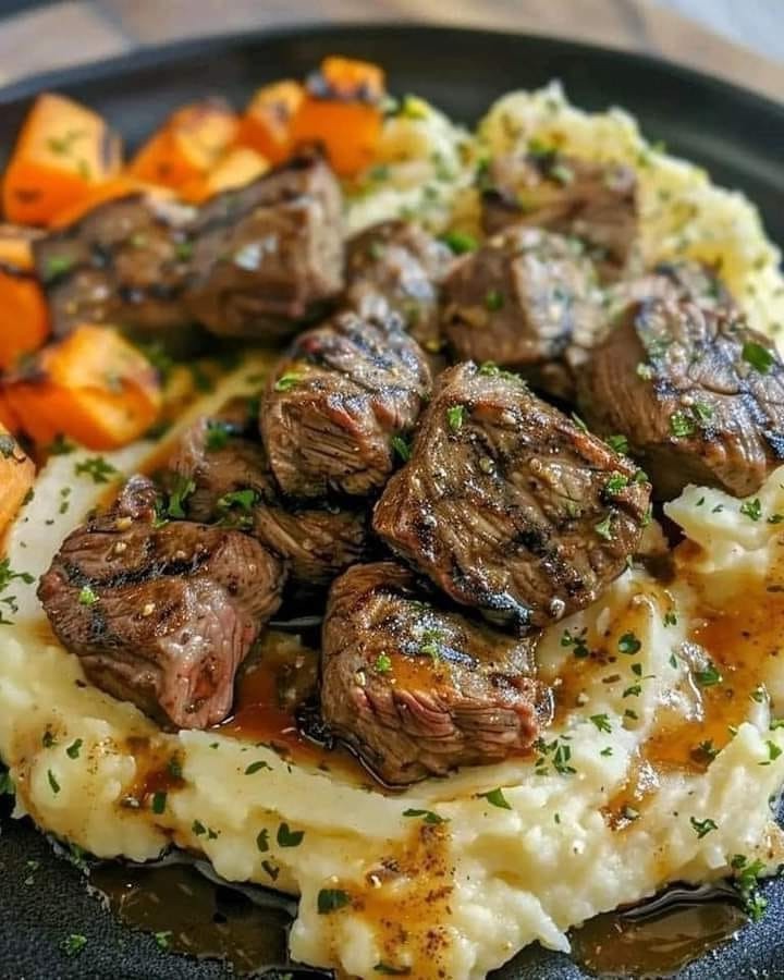 Hearty Seared Beef Tips with Creamy Mashed Potatoes and Roasted Carrots ...