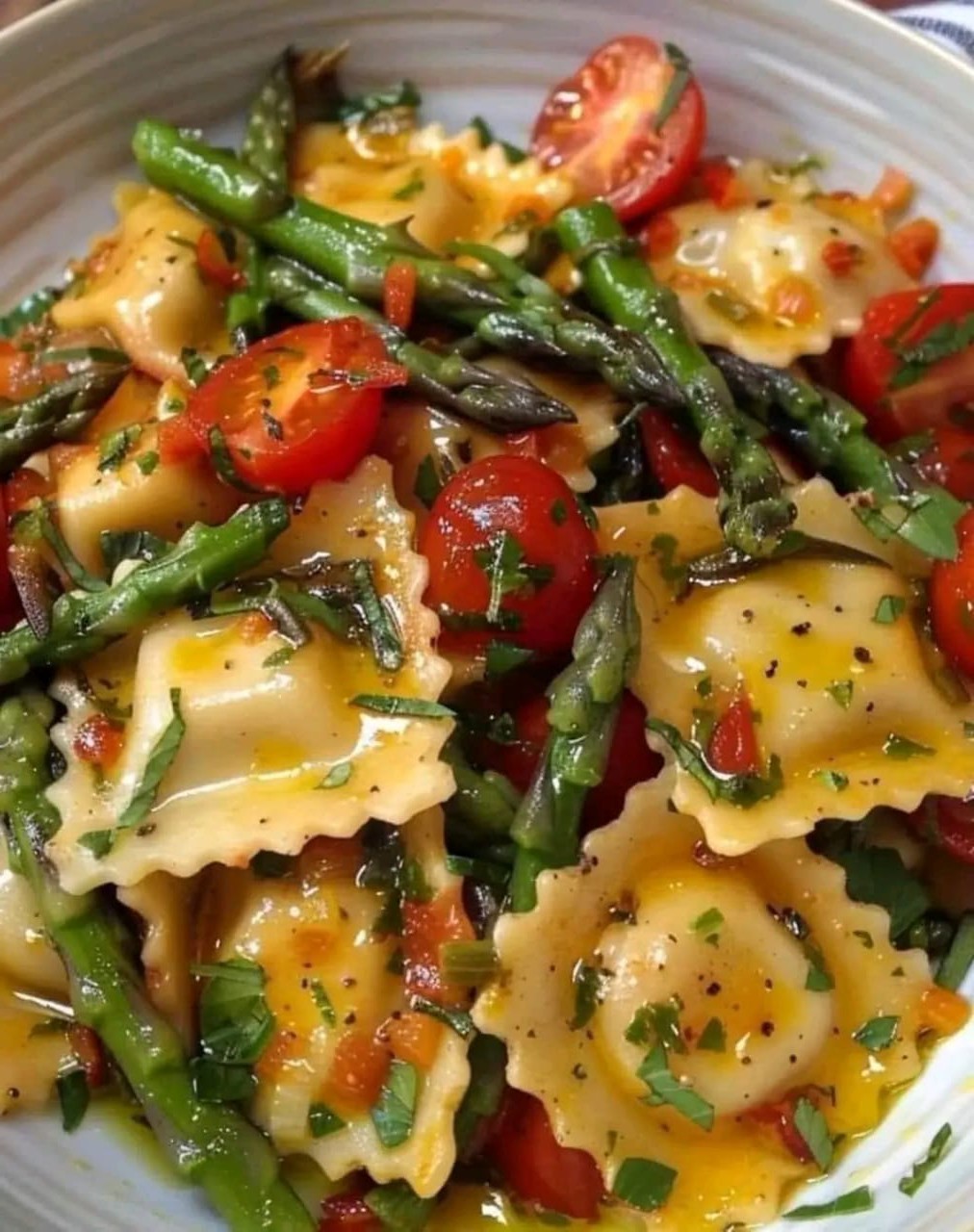 Ravioli with Tomatoes, Asparagus, Garlic, and Herbs - CYSSERO